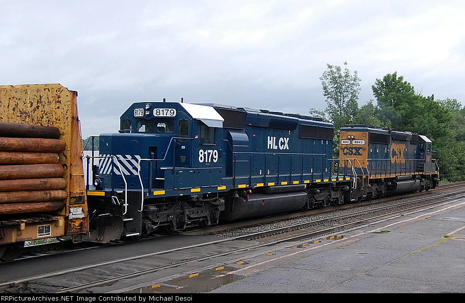 HLCX SD-40-2 #8179 is second out in this westboud passing through the station